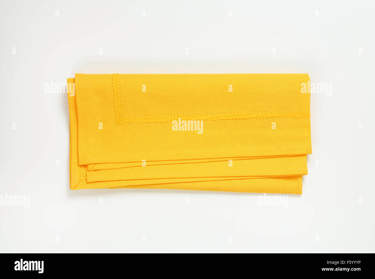 yellow place mat on white background Stock Photo - Alamy