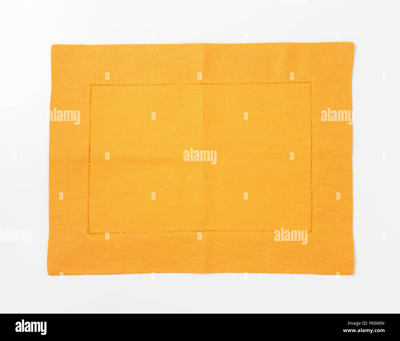 yellow place mat on white background Stock Photo - Alamy