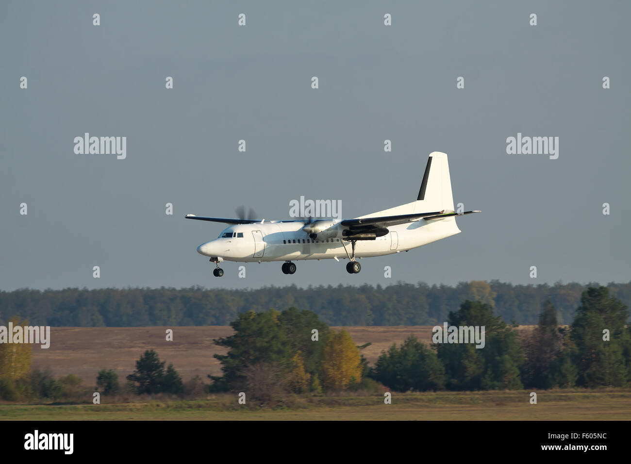 Regional turboprop passenger plane on short final landing Stock Photo ...
