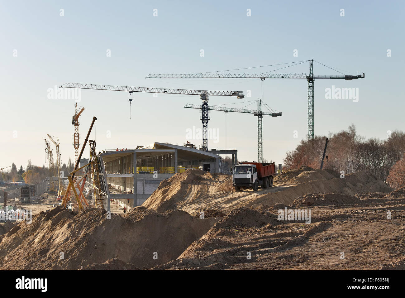 Modern airport terminal construction site on sunset Stock Photo - Alamy