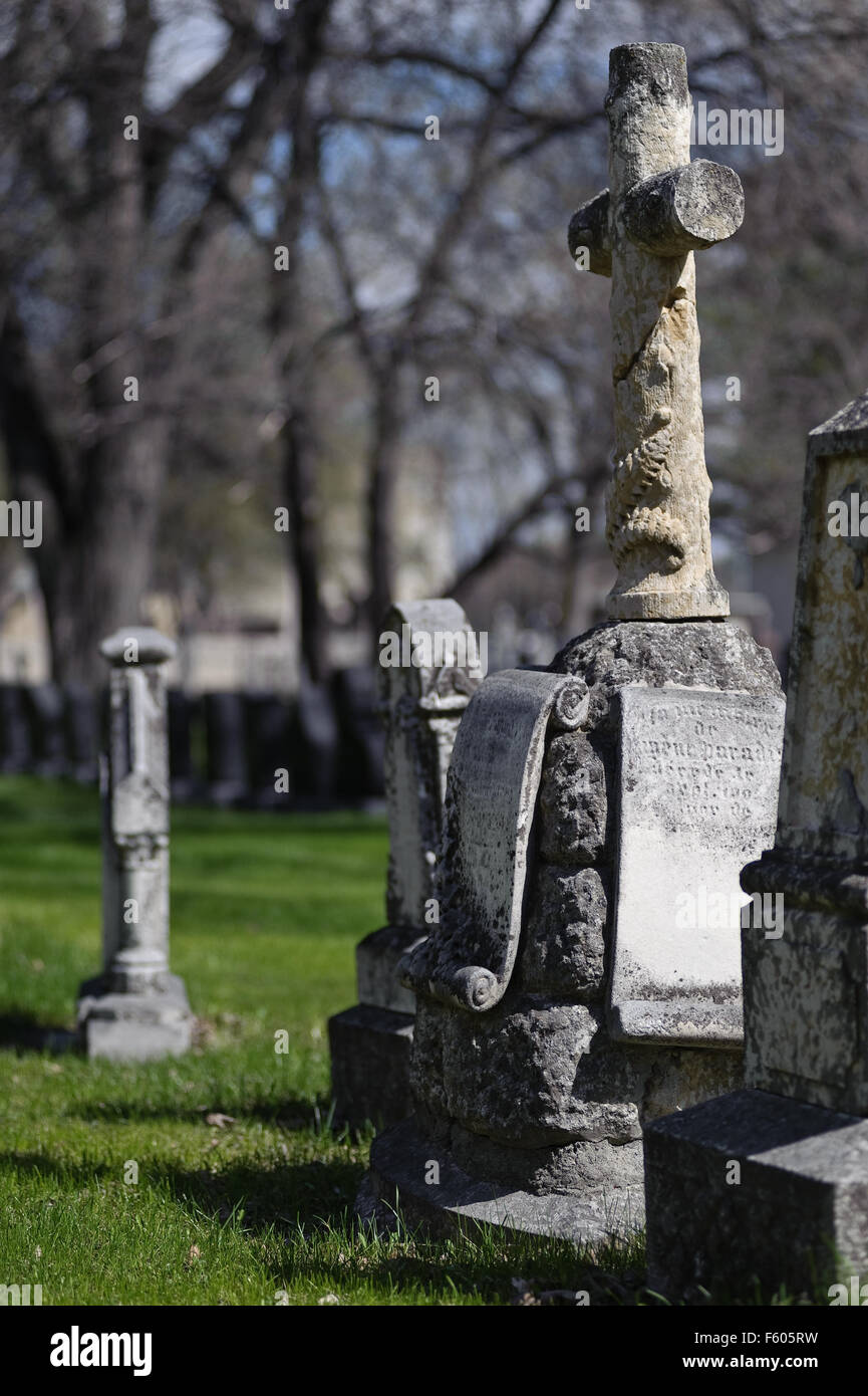 aged tombstones on cemetery of St. Boniface Cathedral, Winnipeg, Canada ...