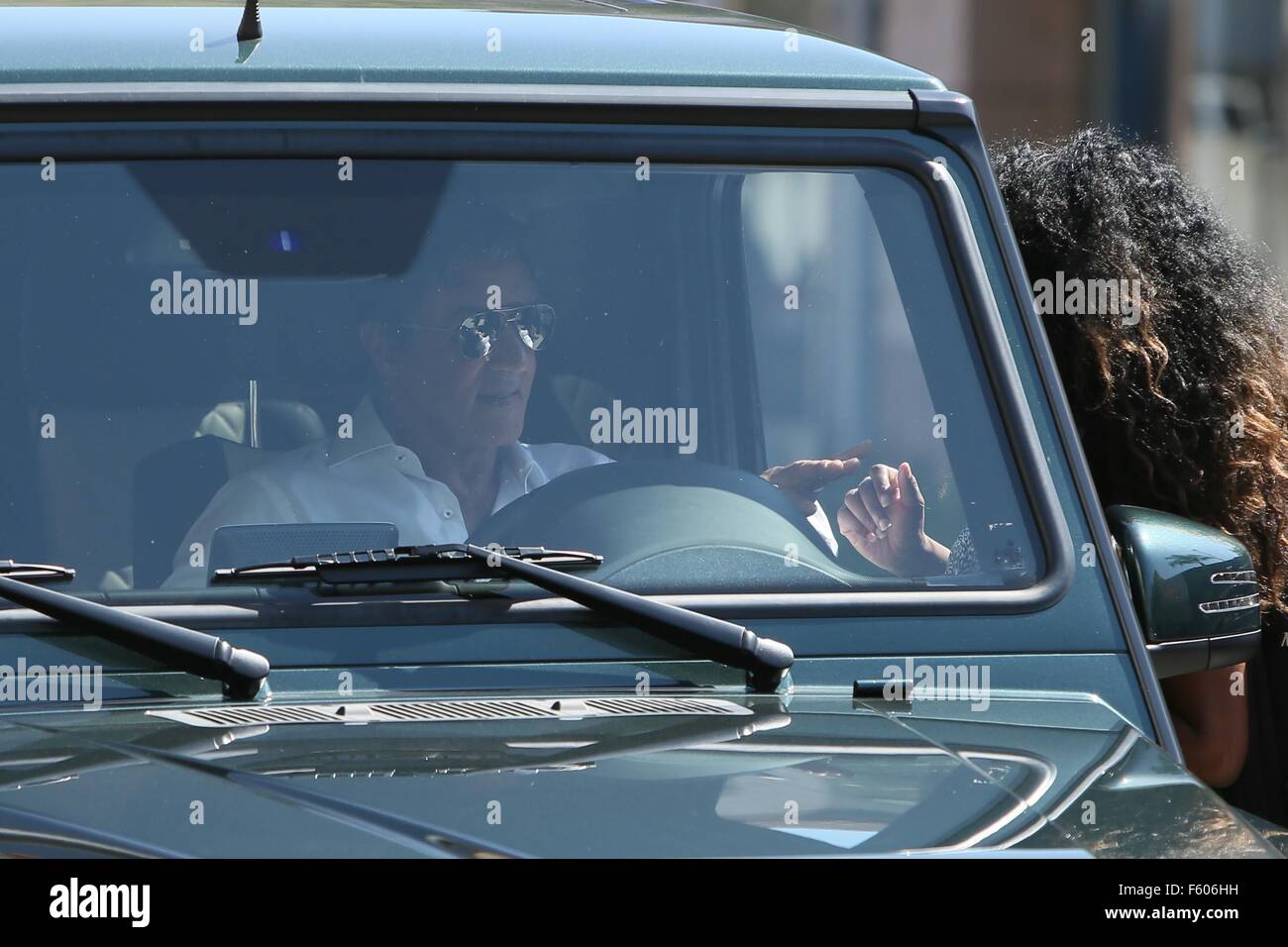 Sylvester stallone seen sitting in hi-res stock photography and images ...