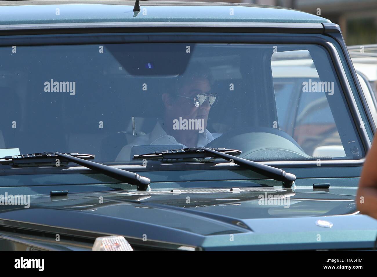 Sylvester stallone seen sitting in High Resolution Stock Photography ...