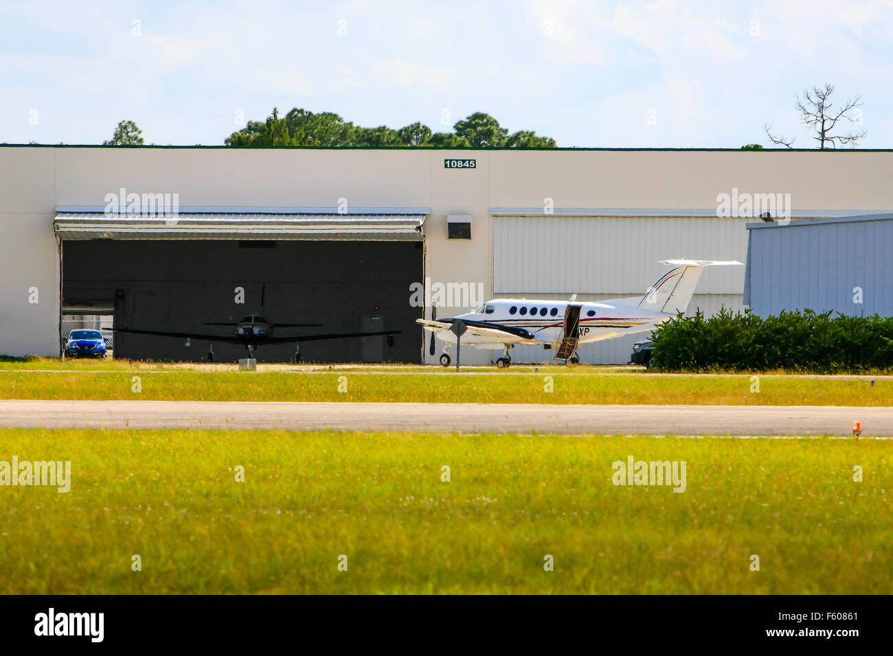 A King Air and Piper Saratoga parked up at Fort Myers Page Field ...