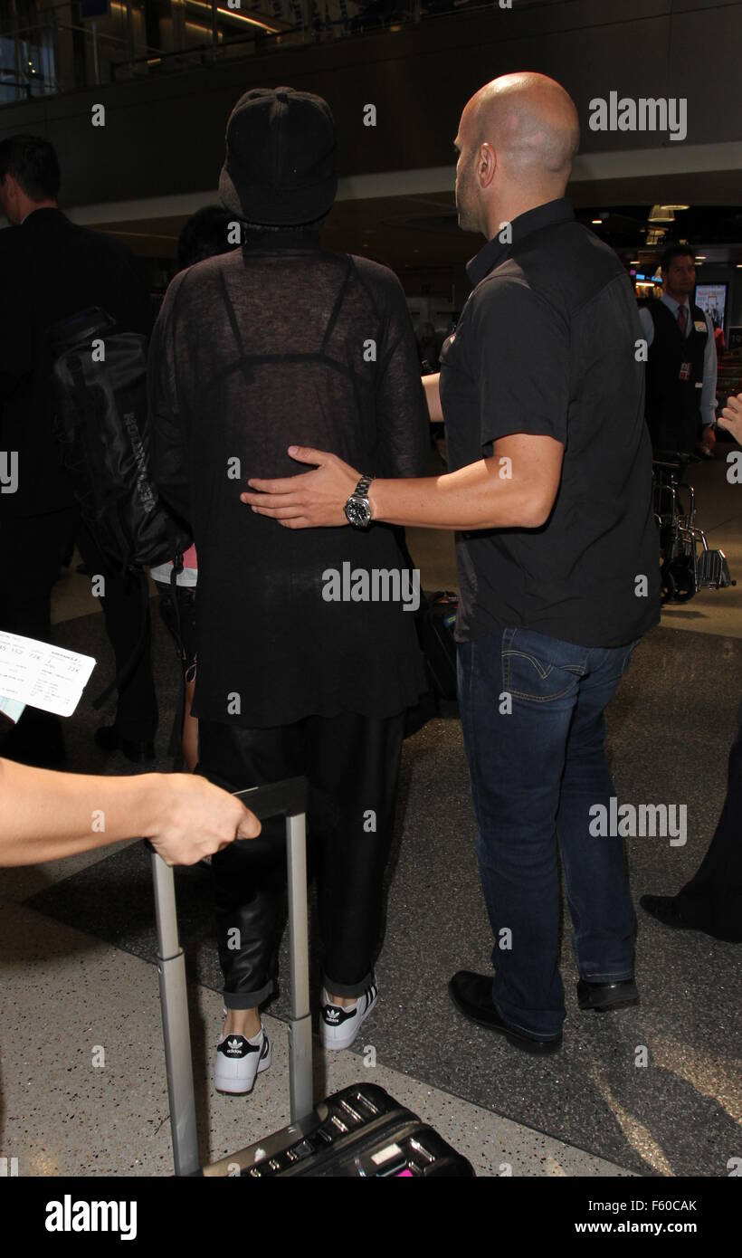 Jessie J dressed all in black with a sheer top departs from Los Angeles ...