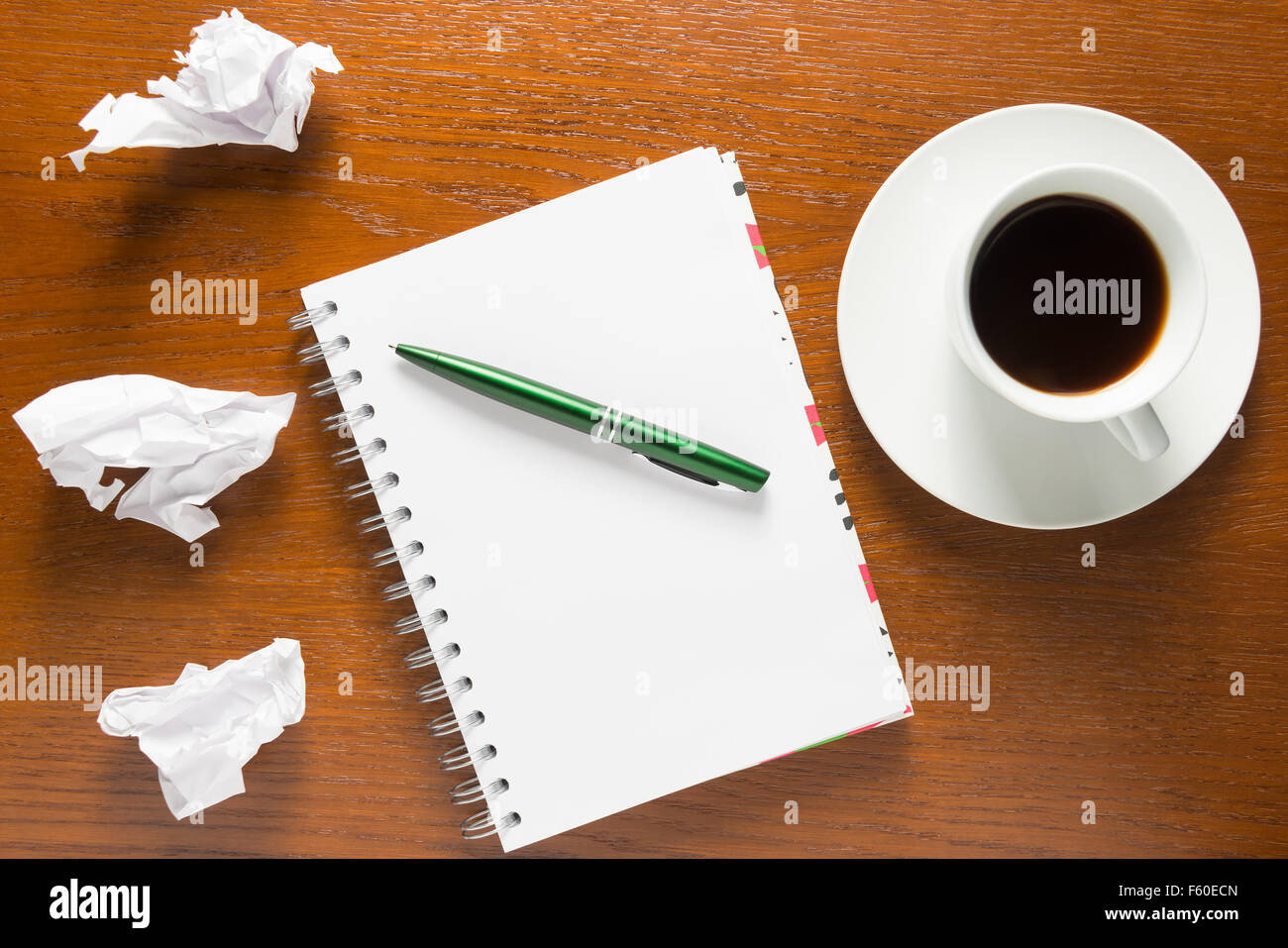 notebook and crumpled sheets of paper on top of view Stock Photo - Alamy