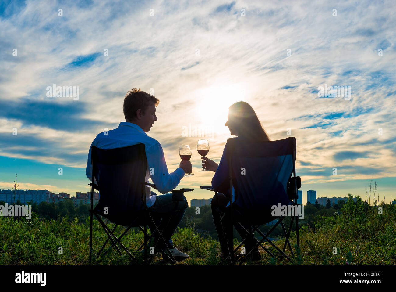 Silhouette couple drinking wine sunset hi-res stock photography and ...