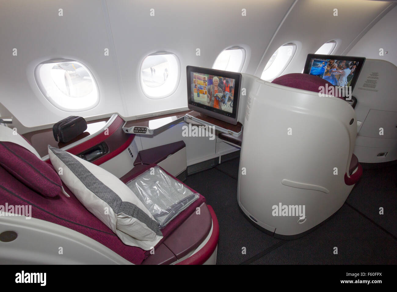PARIS - JUN 18, 2015: First Class seat in a Qatar Airways Airbus A350 ...