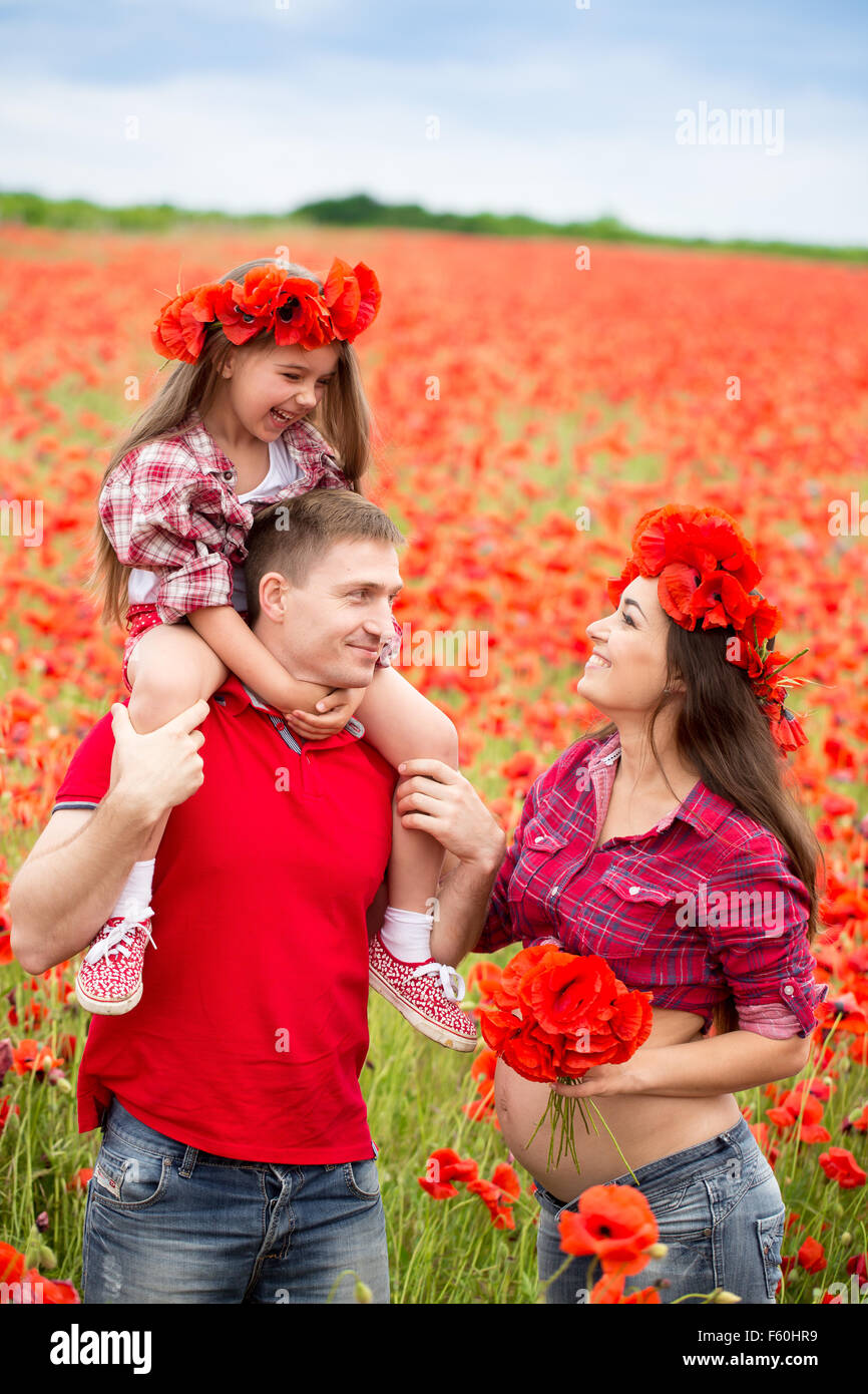 Family on the poppy field Stock Photo - Alamy