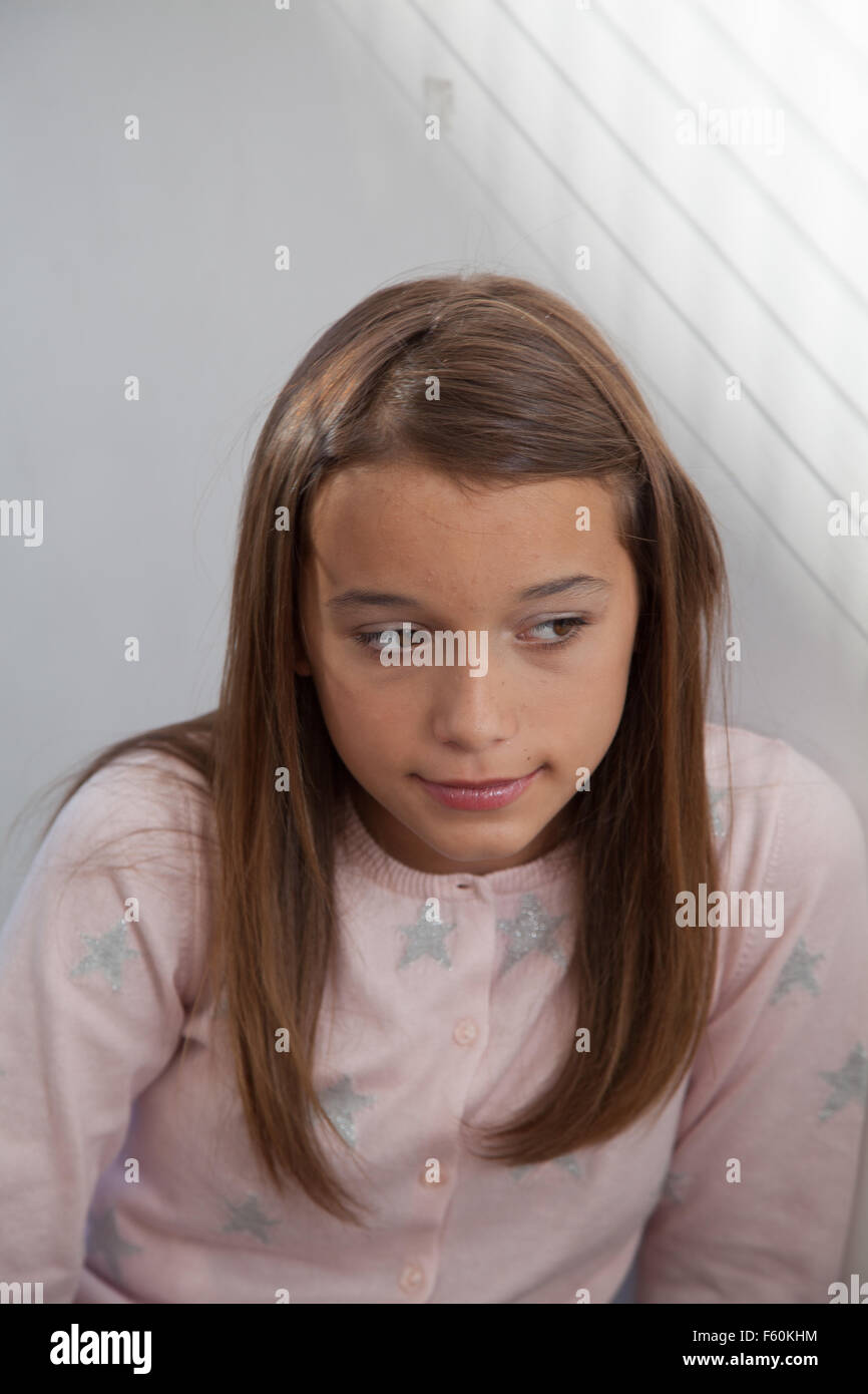 Young girl thinking Stock Photo - Alamy