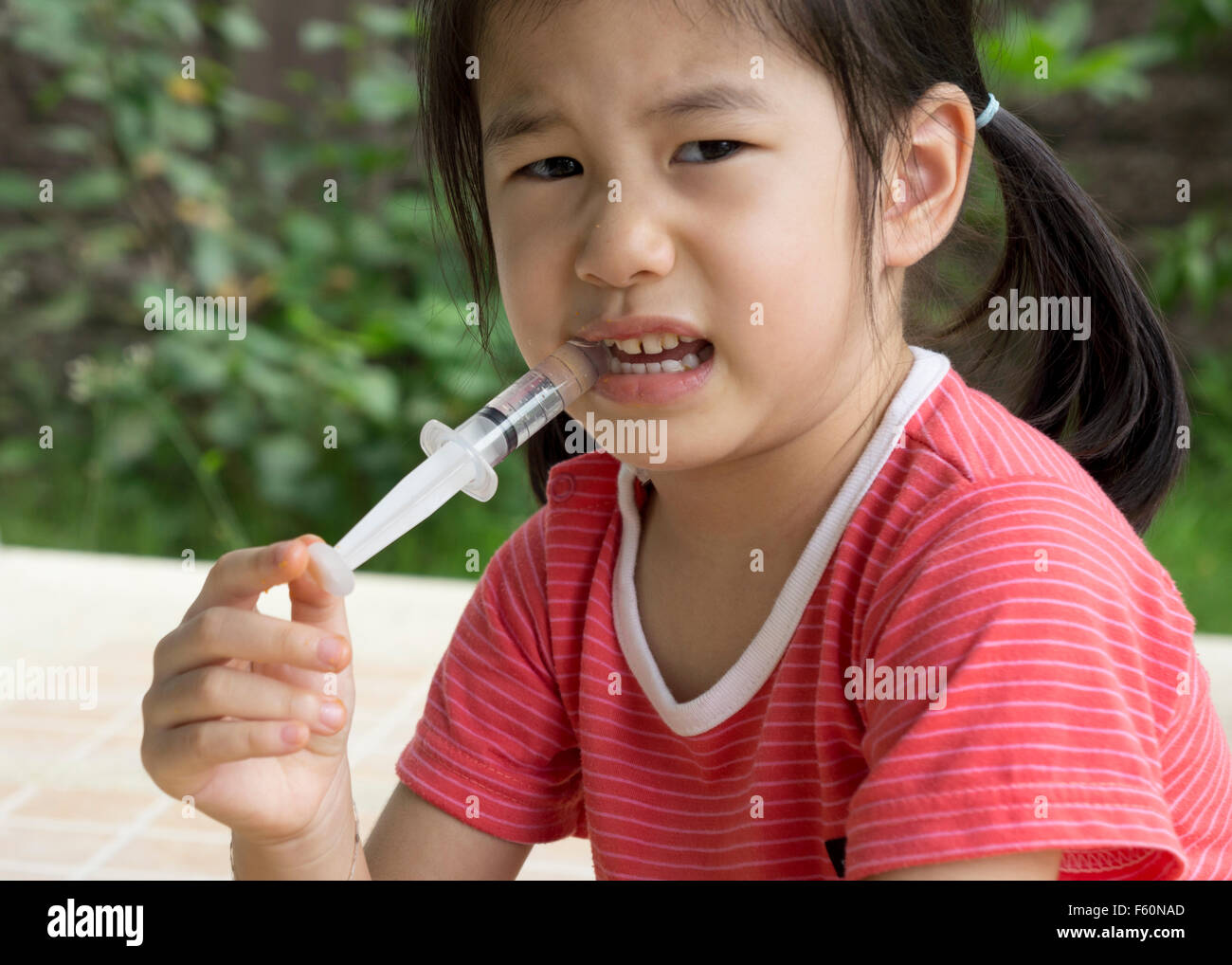 medicine child sick kid medication Stock Photo - Alamy