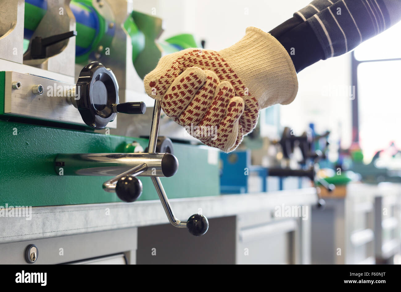 Mechanic working on a machine at workroom Stock Photo - Alamy