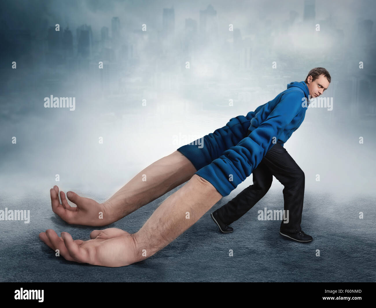 Strange man with big hands over grey background Stock Photo - Alamy