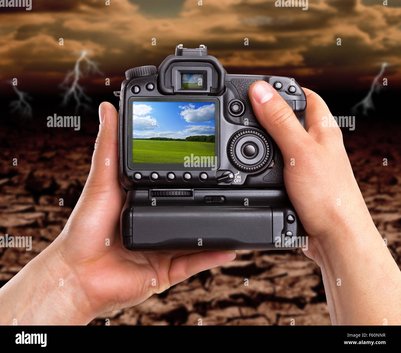 Hands holding digital camera and capturing beautiful landscape against ...