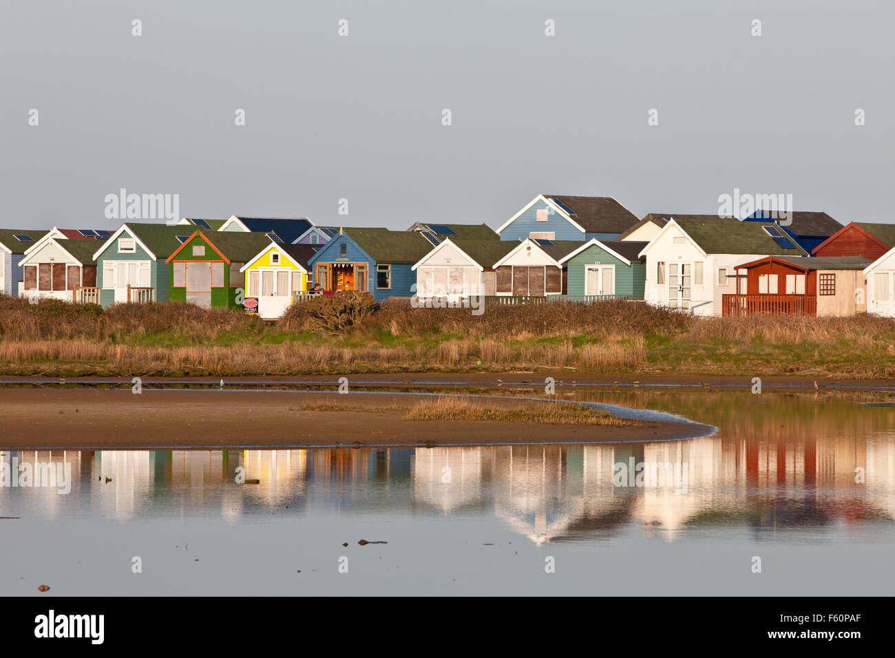 At sundown, beach hut at Mudeford, Christchurch Harbour near Poole ...