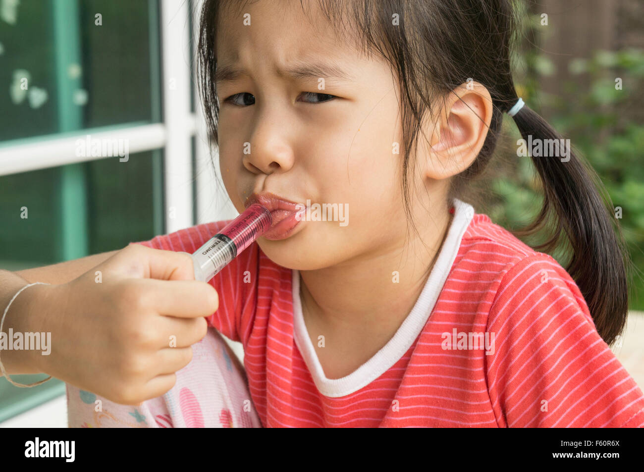 medicine child sick kid medication Stock Photo - Alamy