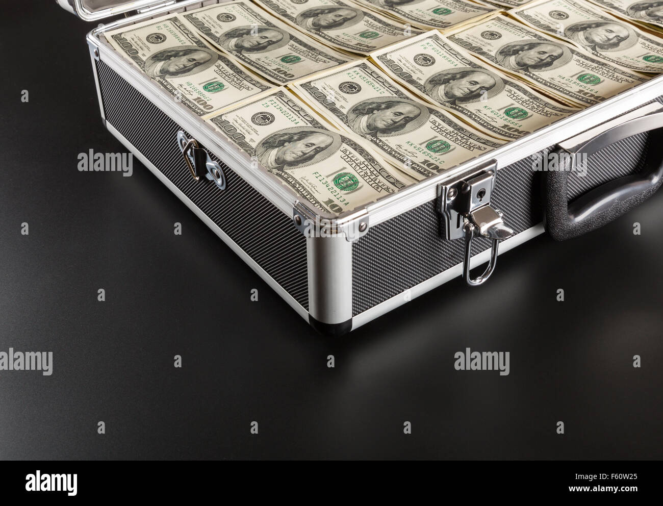 Case full of money isolated on gray background Stock Photo - Alamy