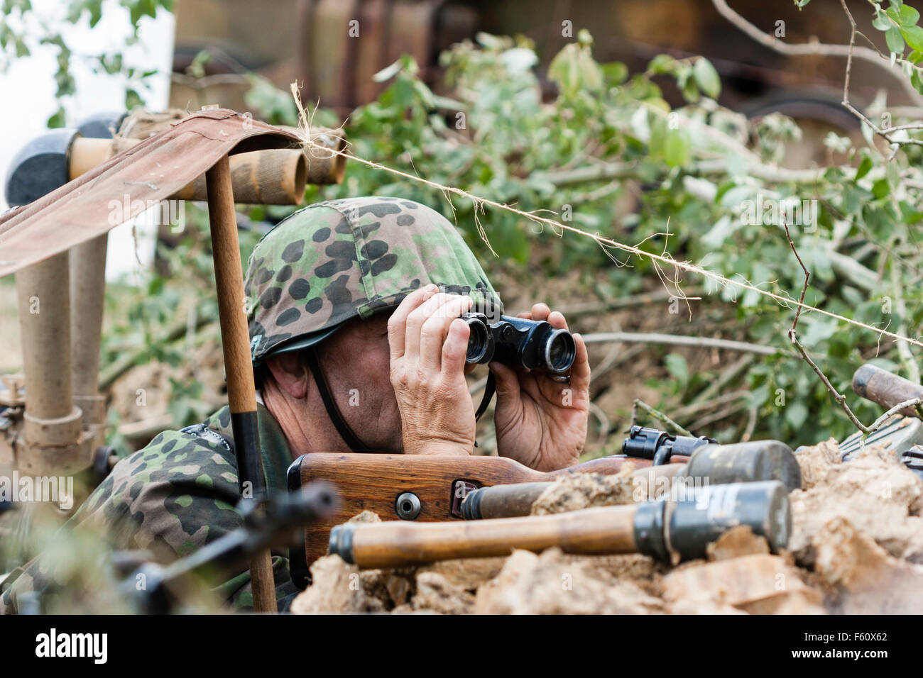 World war two re-enactment. German officer wearing camouflage smock and ...