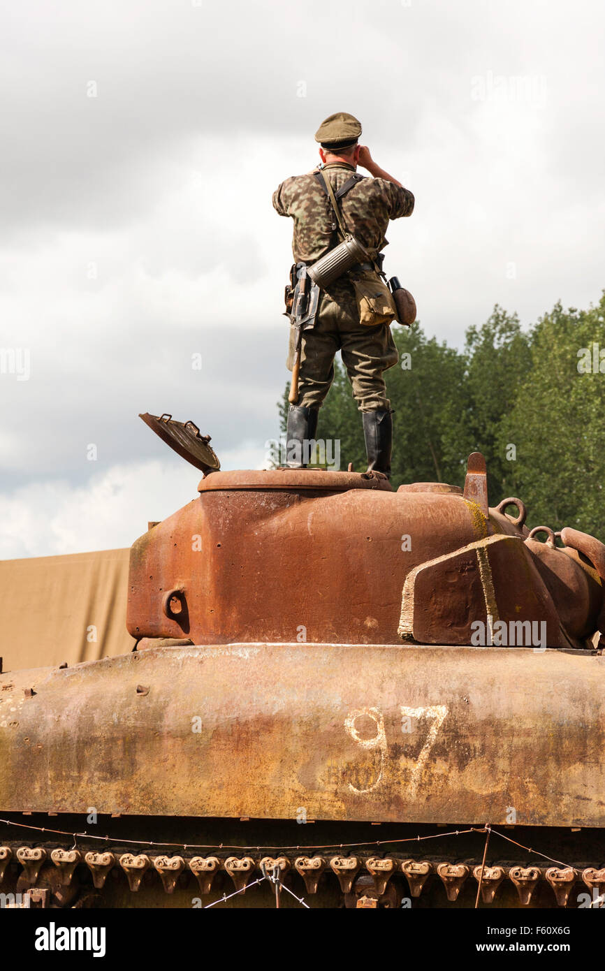World war two re-enactment. German officer (seen from behind), standing ...