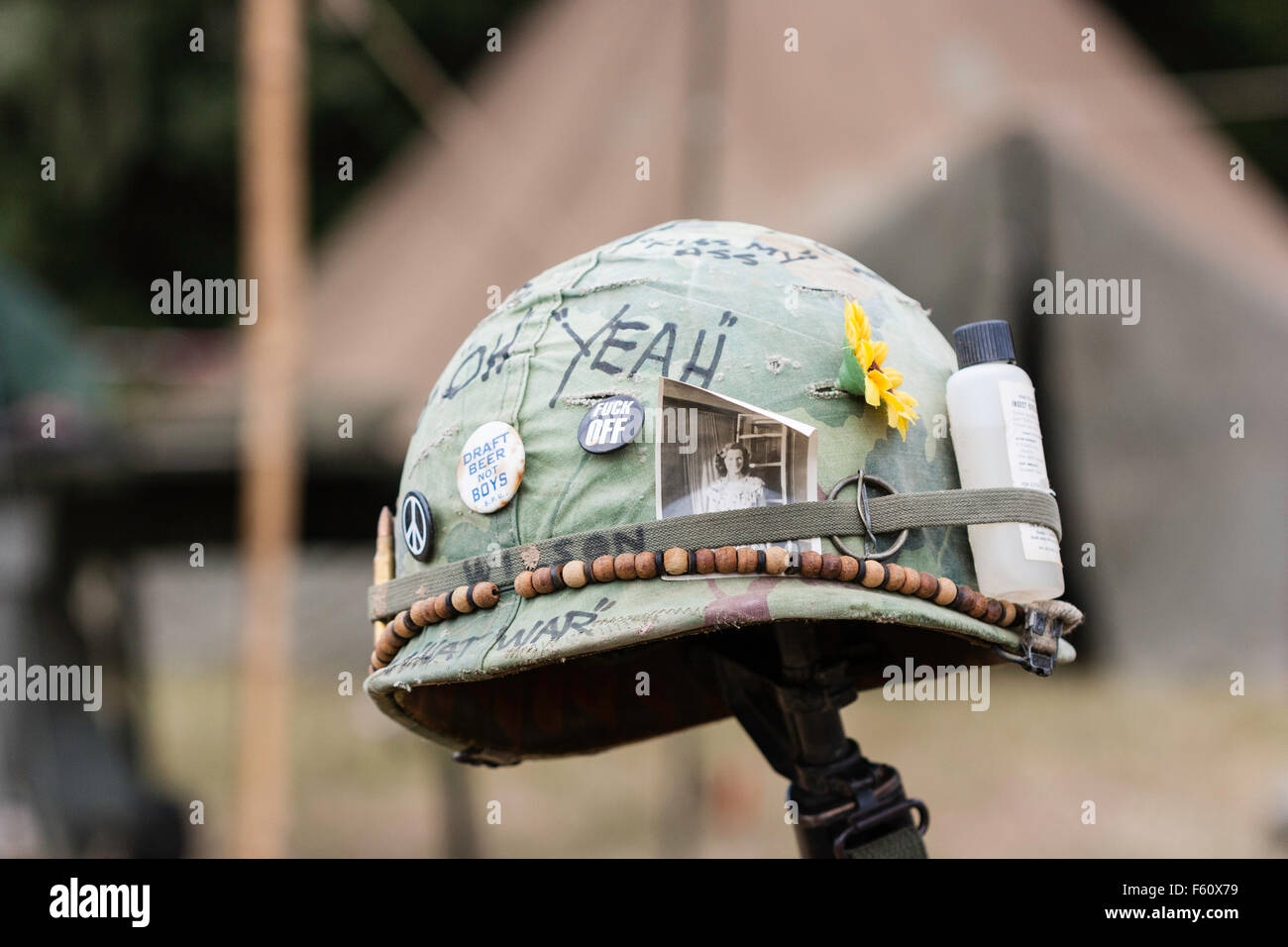 Vietnam war Re-enactment. American GI helmet sitting on top of a rifle ...
