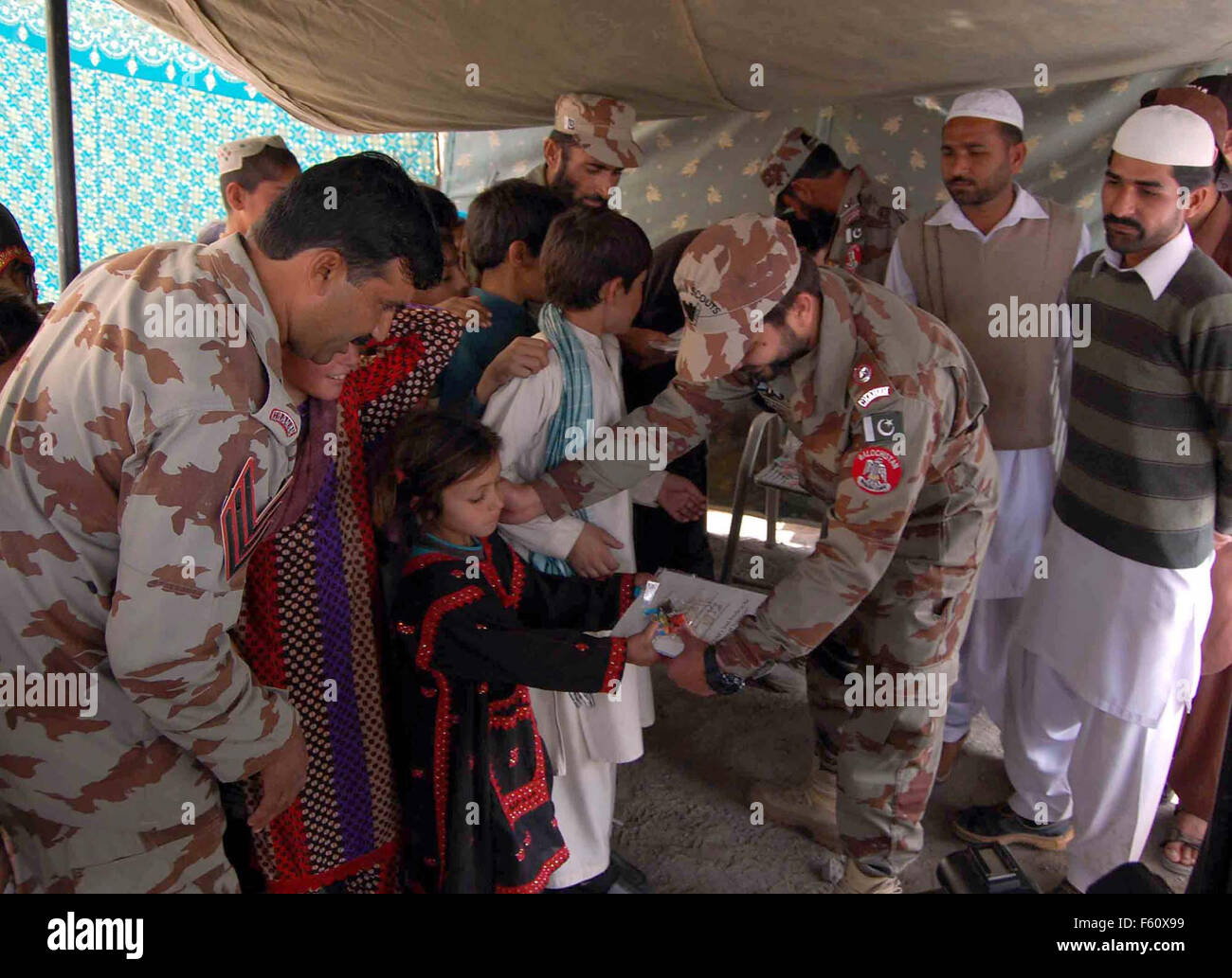 Frontier Corps commander Major Umer giving the free books and gifts to ...