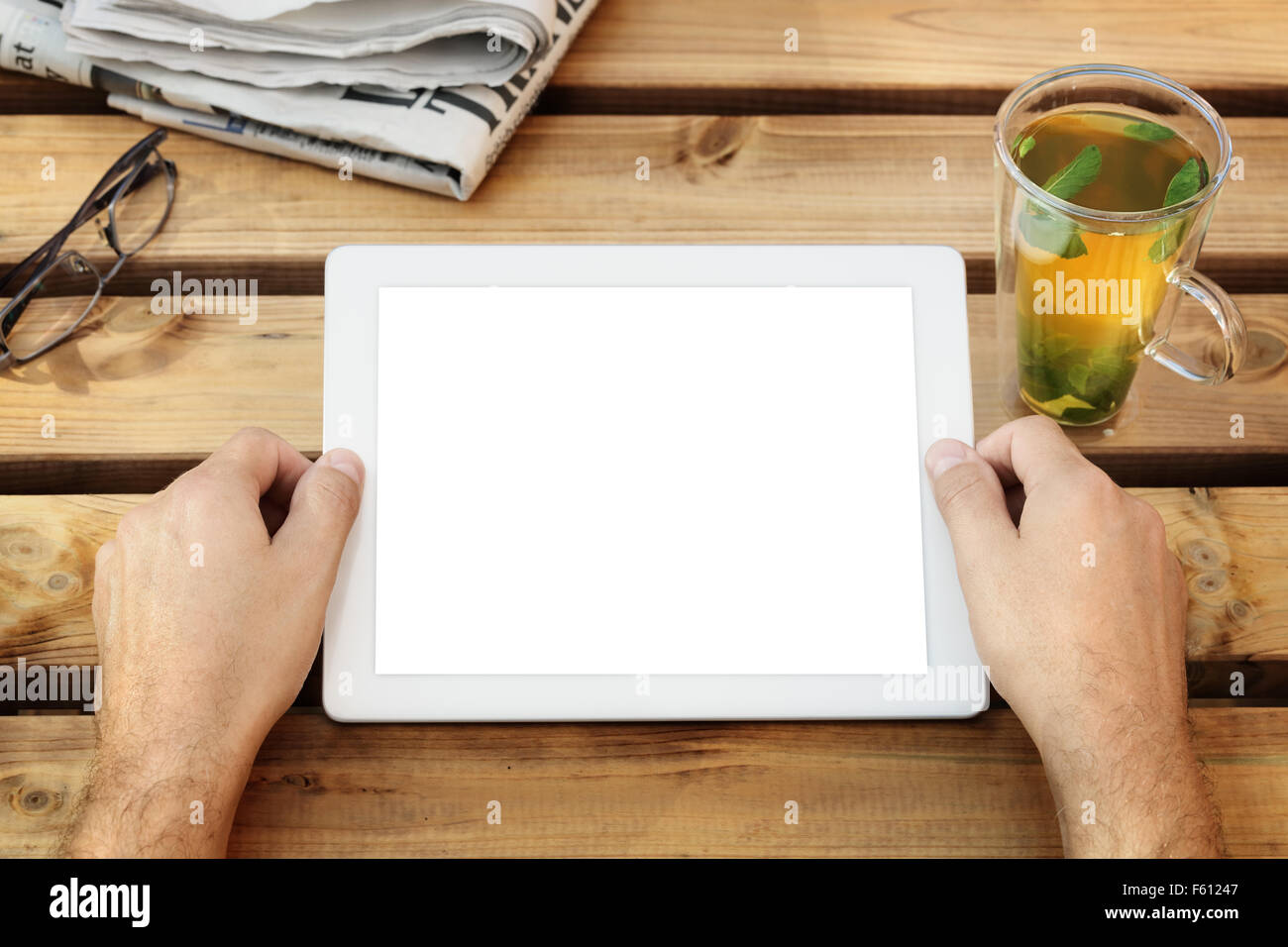 Digital tablet with blank screen in coffee shop cafe Stock Photo - Alamy