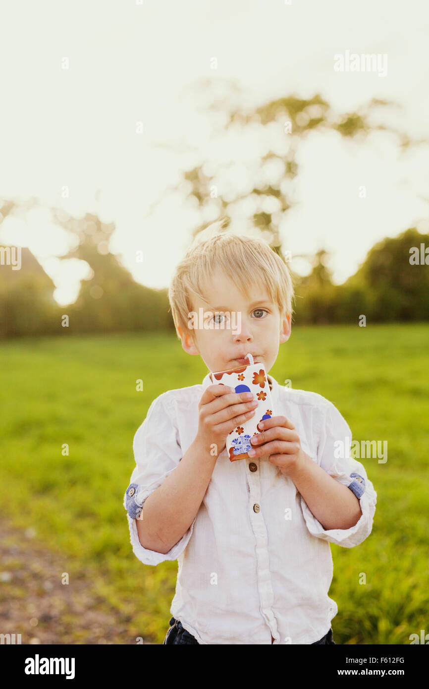 Boy drinking juice box hi-res stock photography and images - Alamy