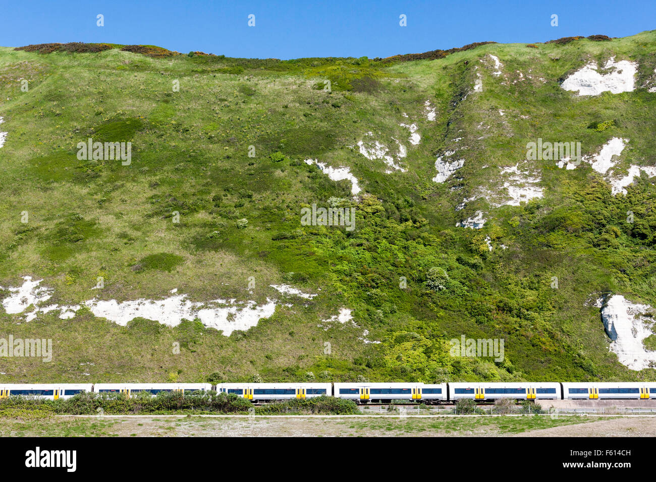 England, Dover. A south Eastern yellow and white train passes the ...