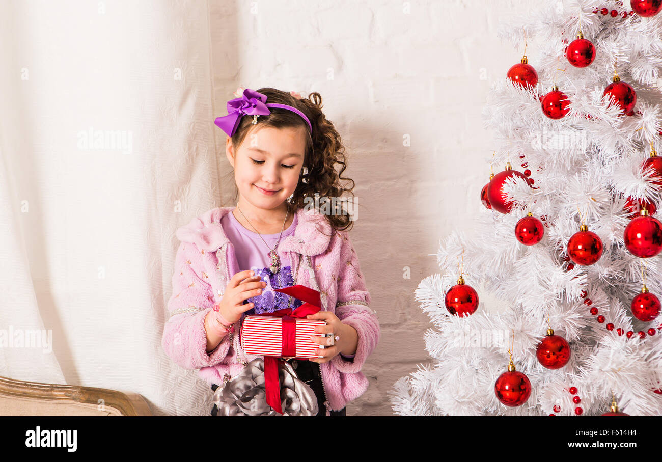 Happy child opening Christmas gift box Stock Photo - Alamy