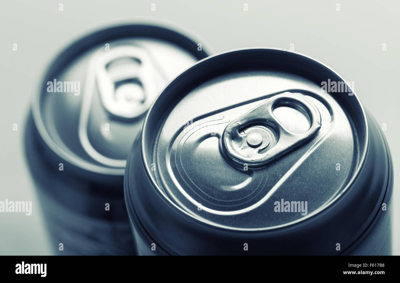 Aluminum cans closeup picture isolated on gray Stock Photo - Alamy