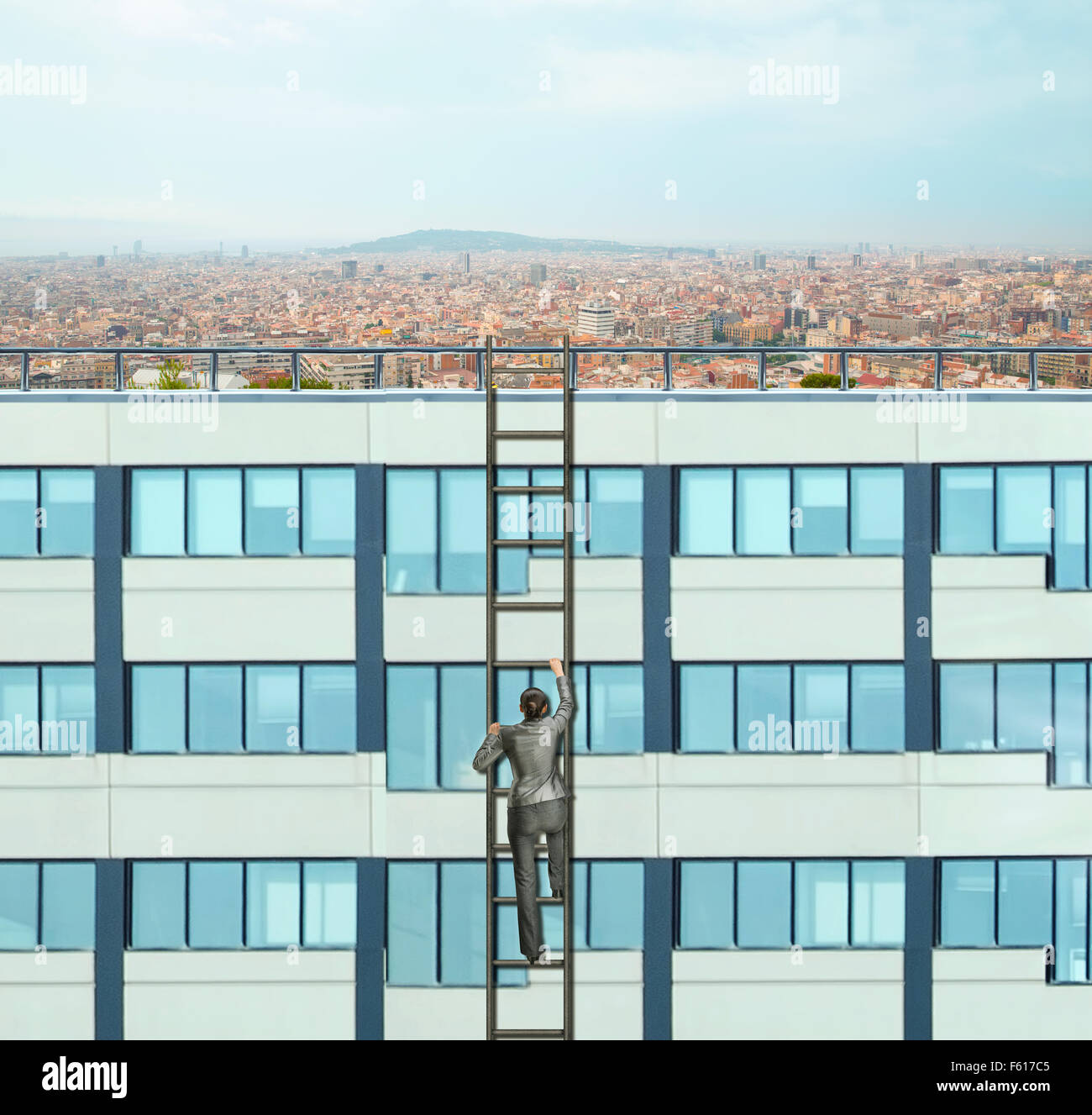 Businesswoman climbing the ladder to the skyscraper roof Stock Photo ...