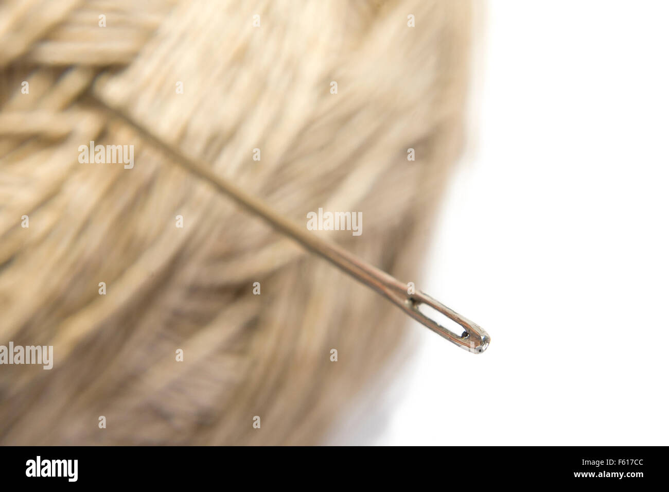 Needle with ball of the threads isolated macro Stock Photo - Alamy