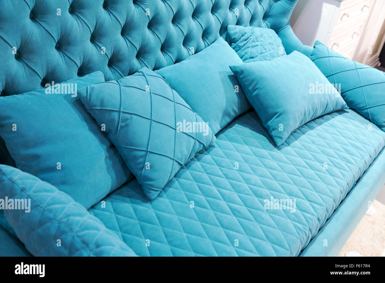 Close up of modern blue sofa Stock Photo - Alamy