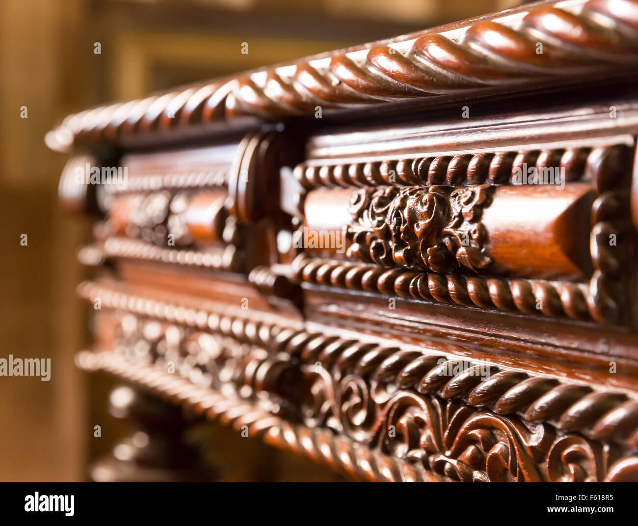 Luxurious table with wood engraving on the case close up Stock Photo ...