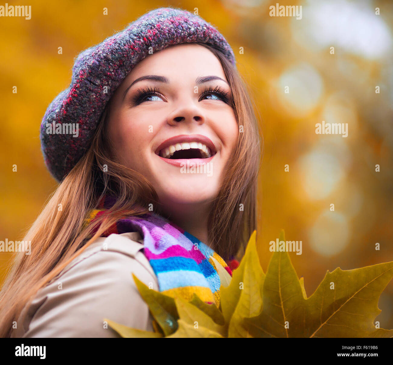 Young woman in autumn park Stock Photo - Alamy