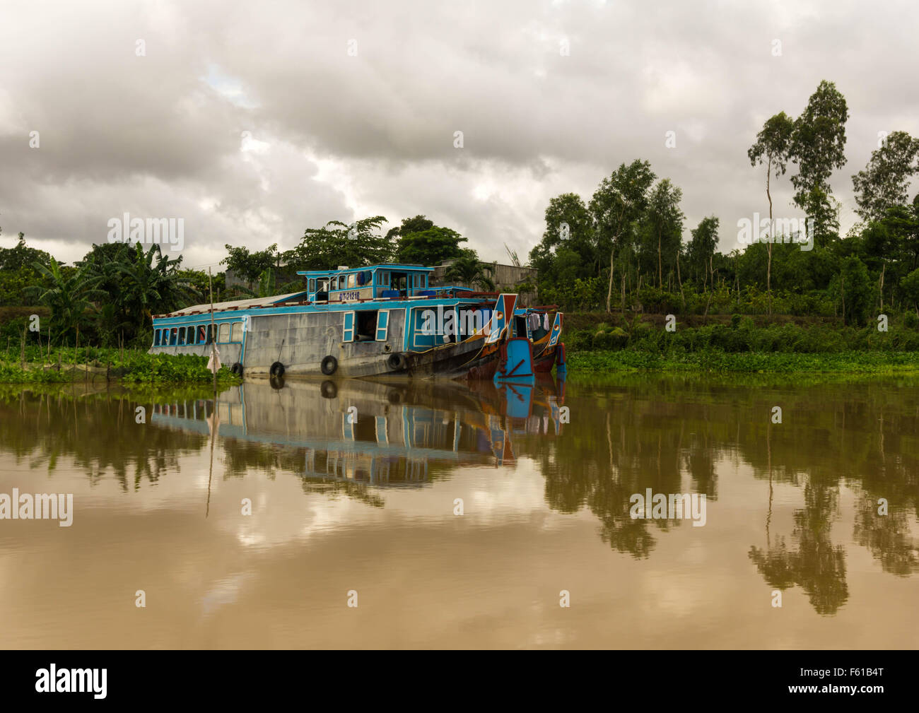 Mekong Delta, Vietnam: A typical river scene in with traditional ...