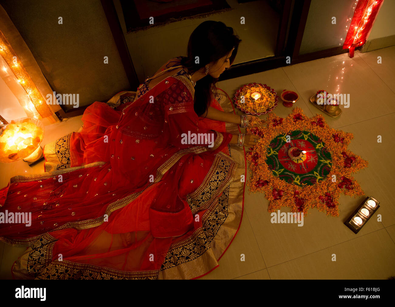 India woman making rangoli festival hi-res stock photography and images ...