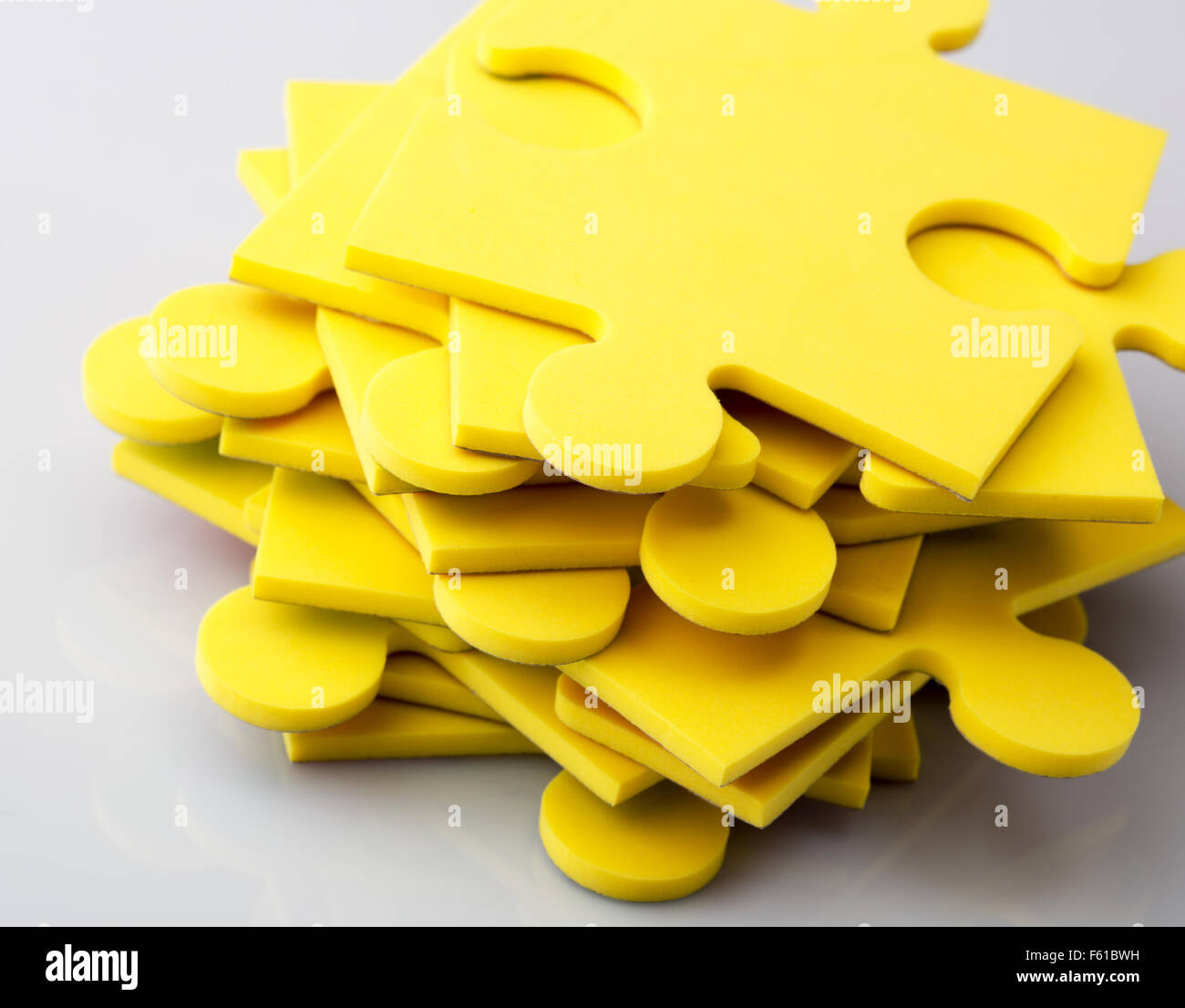 Stack of jigsaw puzzle pieces Stock Photo - Alamy