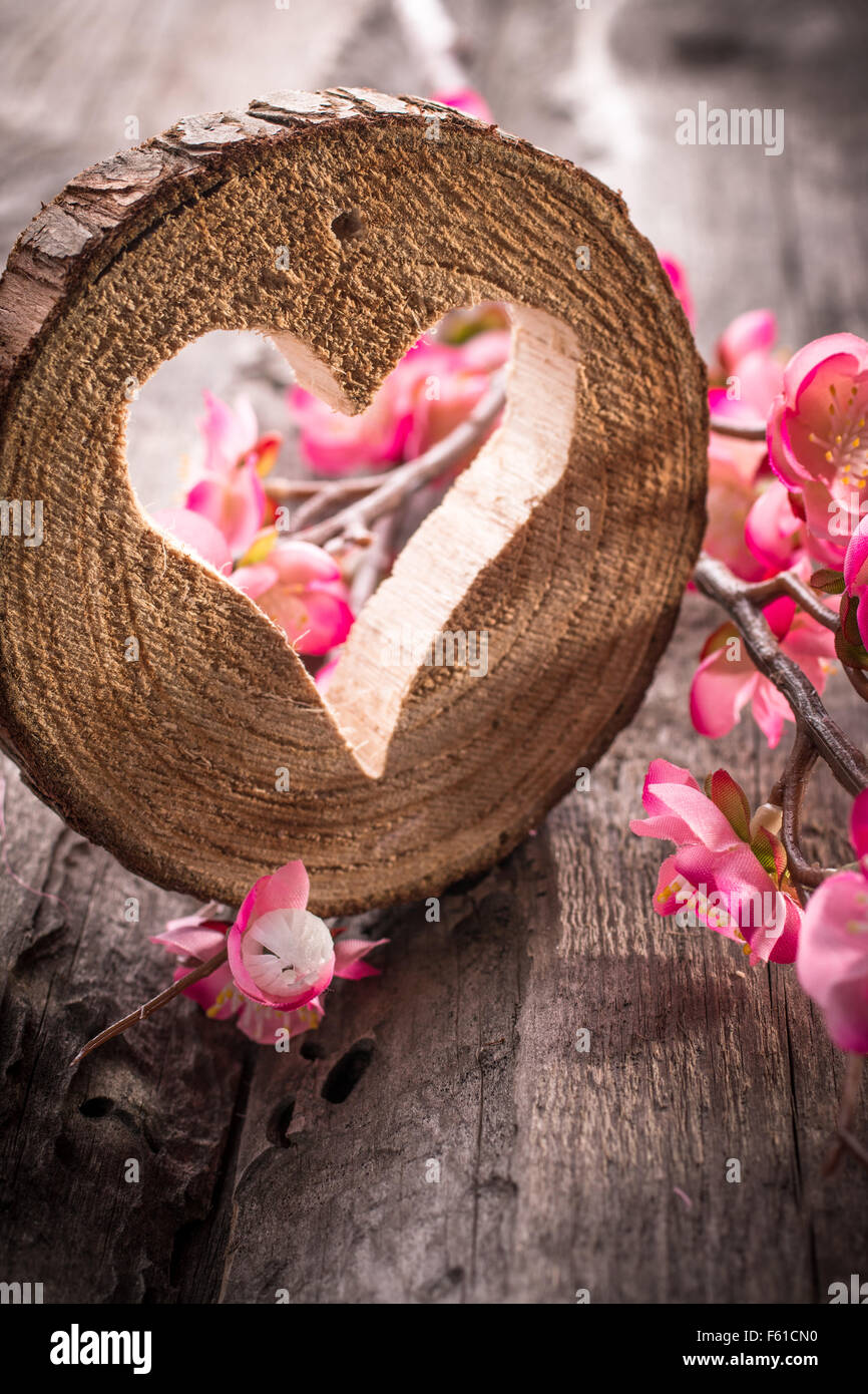 Light heart on rustic wooden background Stock Photo - Alamy