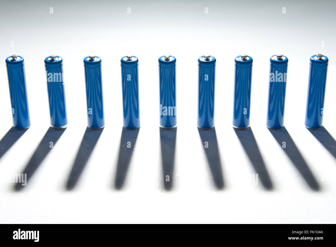 Row of blue batteries Stock Photo - Alamy
