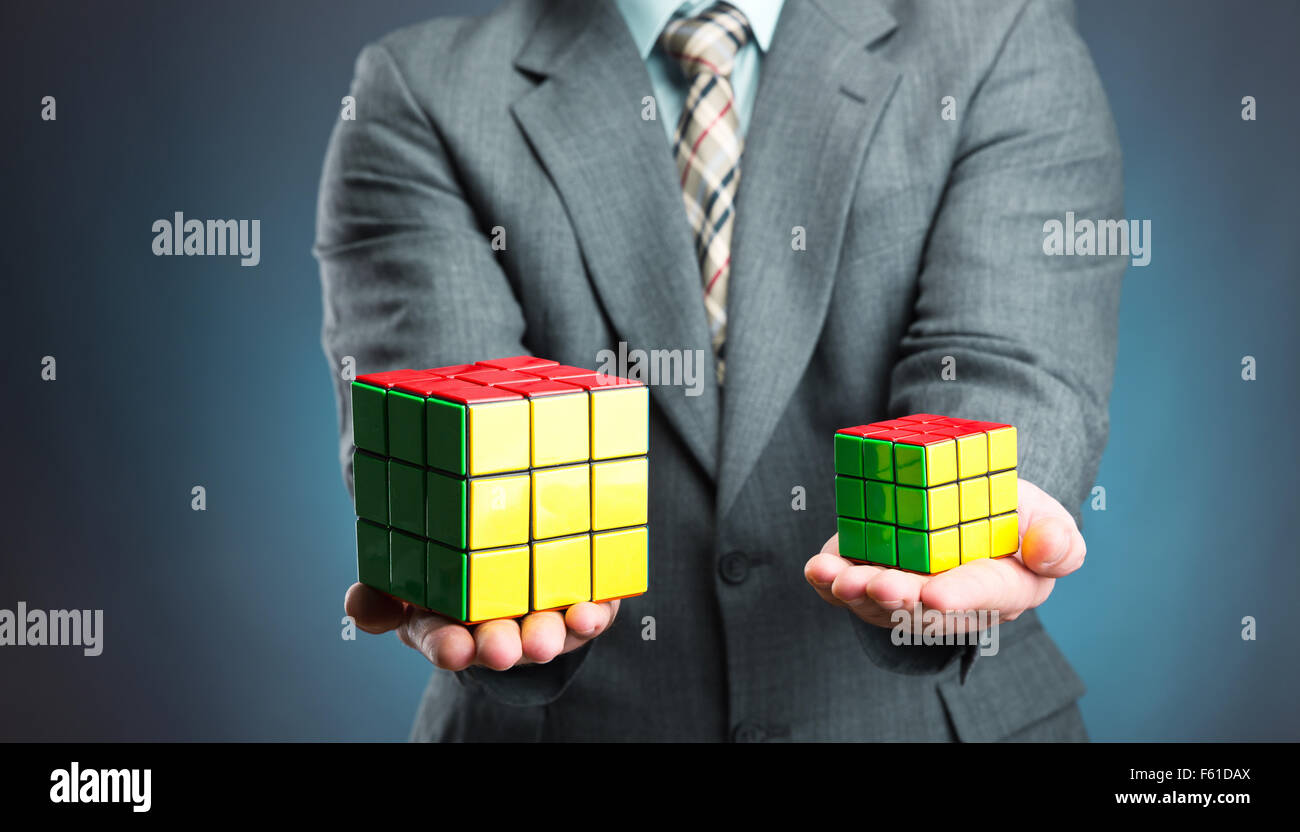 Businessman hand holding rubik cube hi-res stock photography and images ...