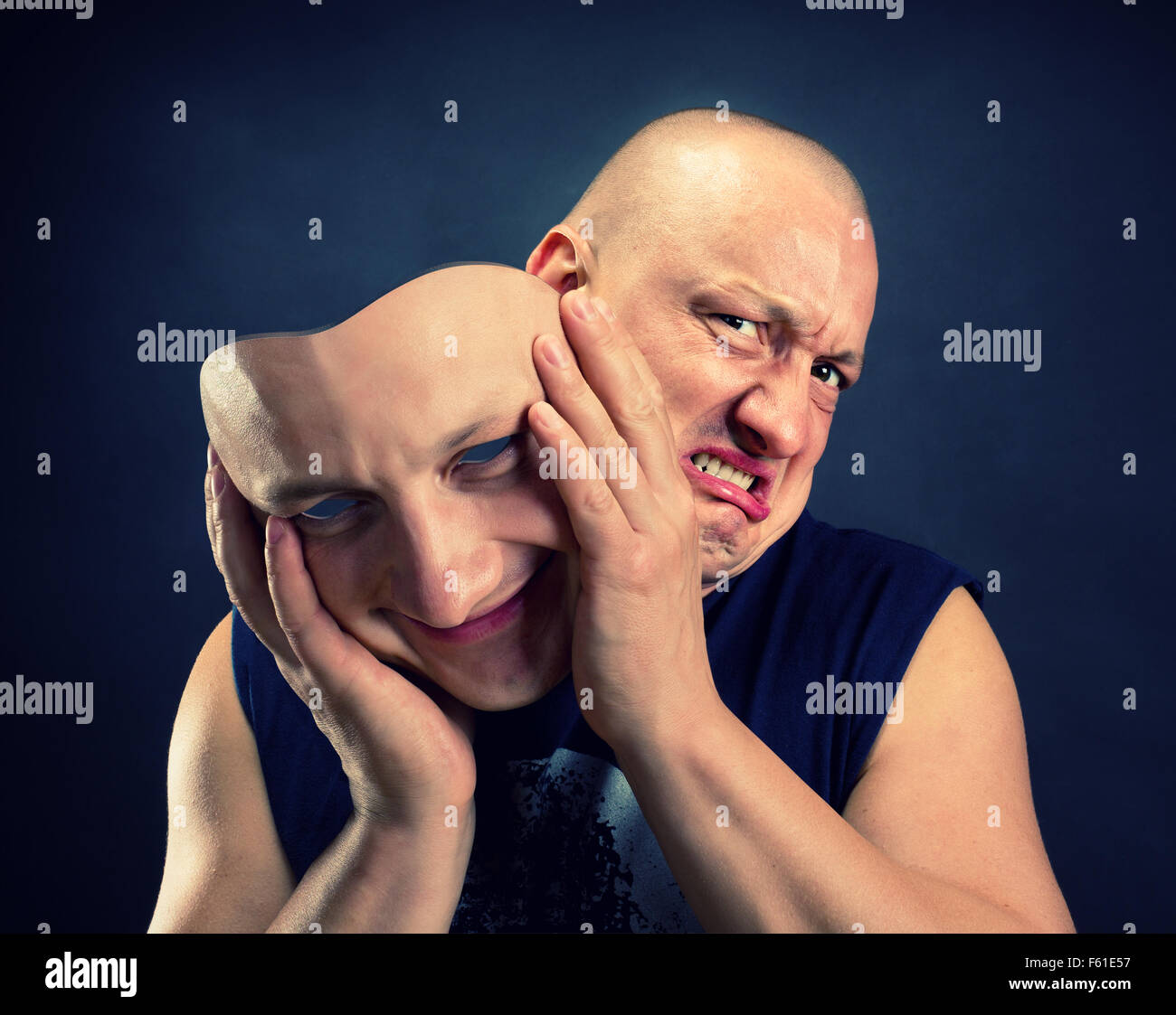 Man taking off his happy facial mask Stock Photo - Alamy