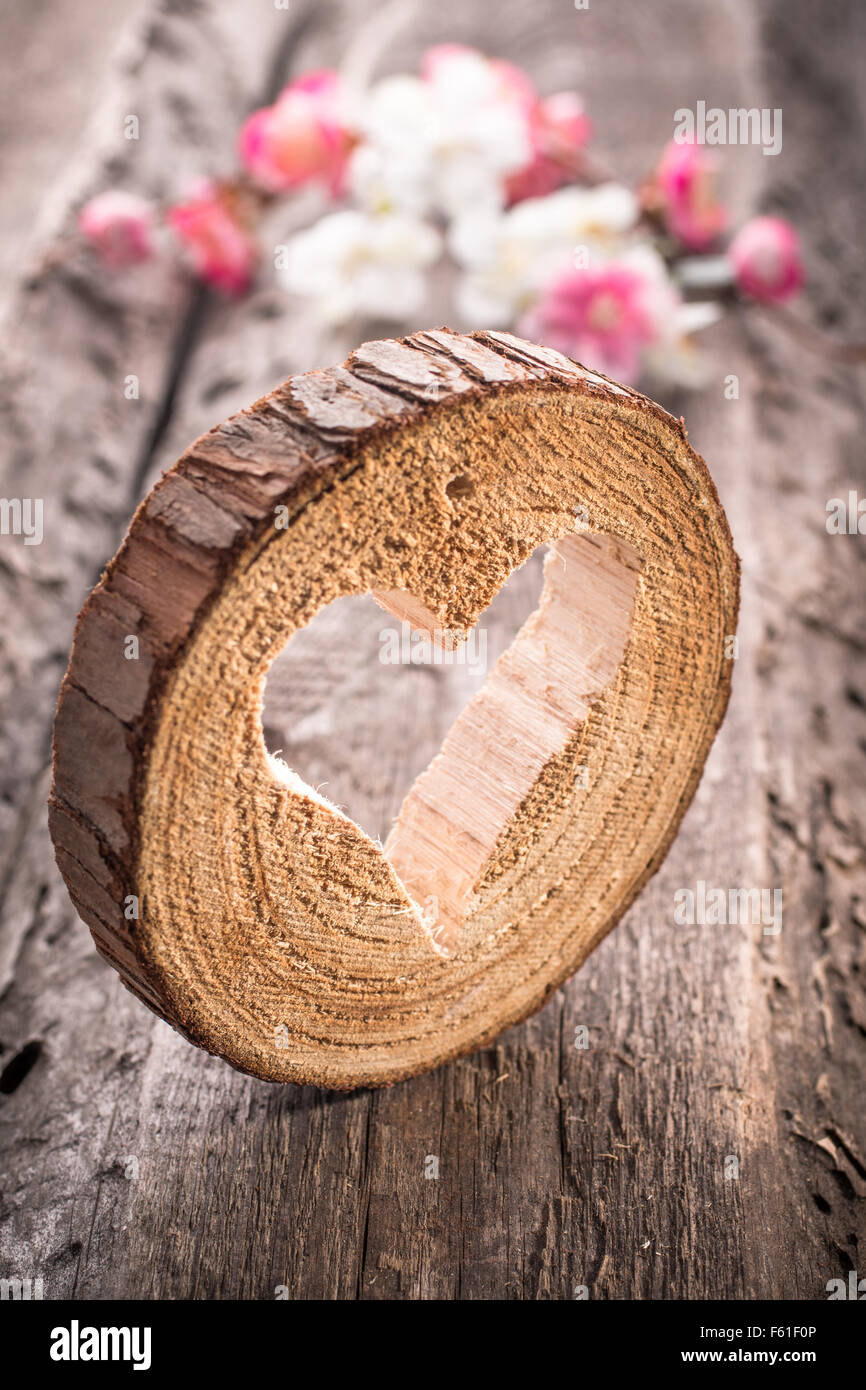 Light heart on rustic wooden background Stock Photo - Alamy