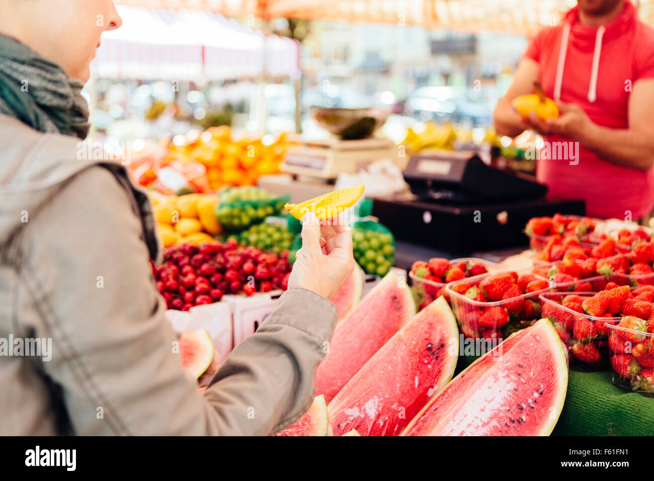 Women buying mango hi-res stock photography and images - Alamy
