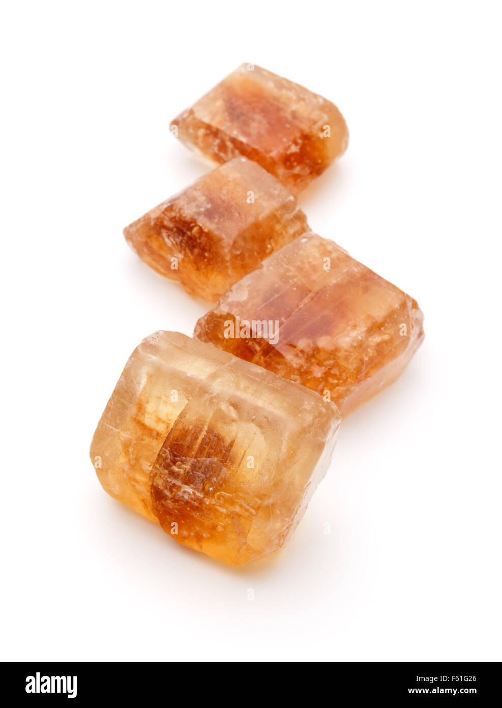 Brown caramelized lump cane sugar cube isolated on white background ...