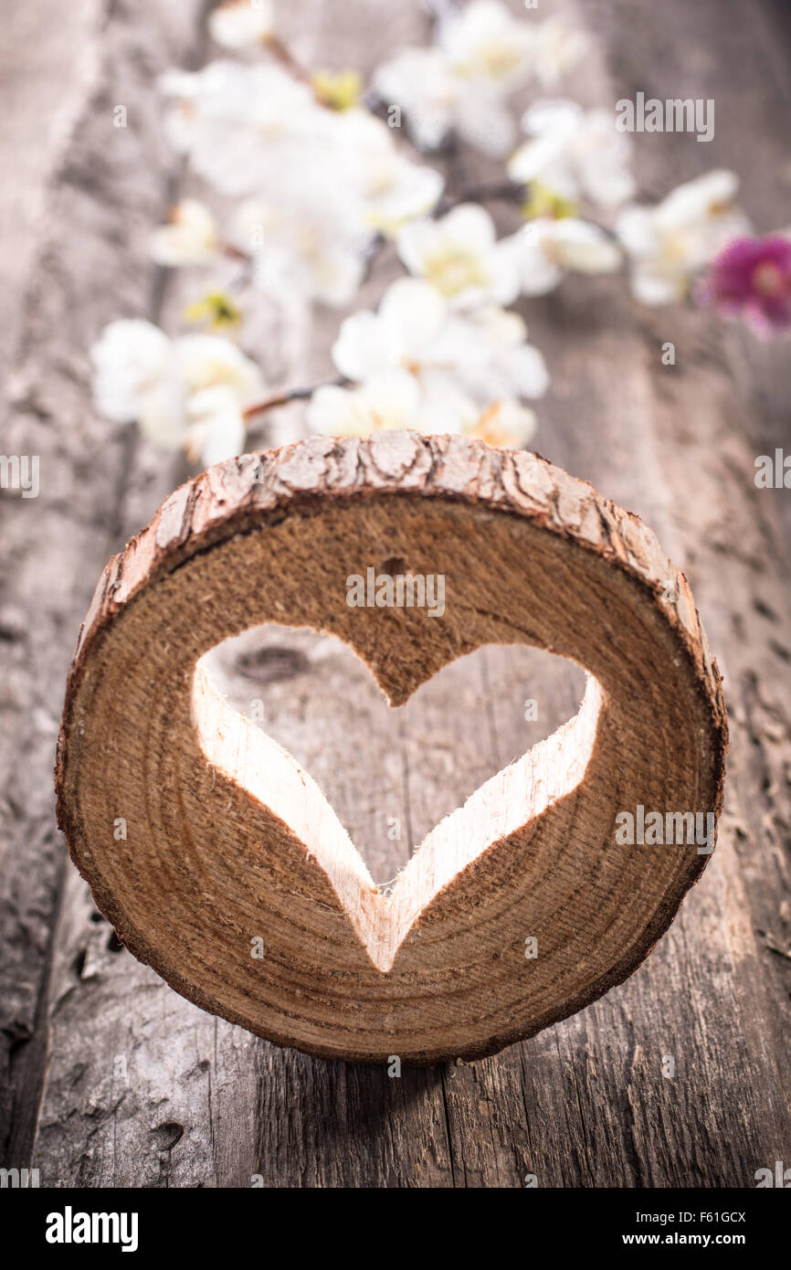 Light heart on rustic wooden background Stock Photo - Alamy