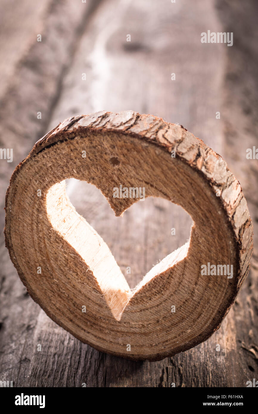 Light heart on rustic wooden background Stock Photo - Alamy