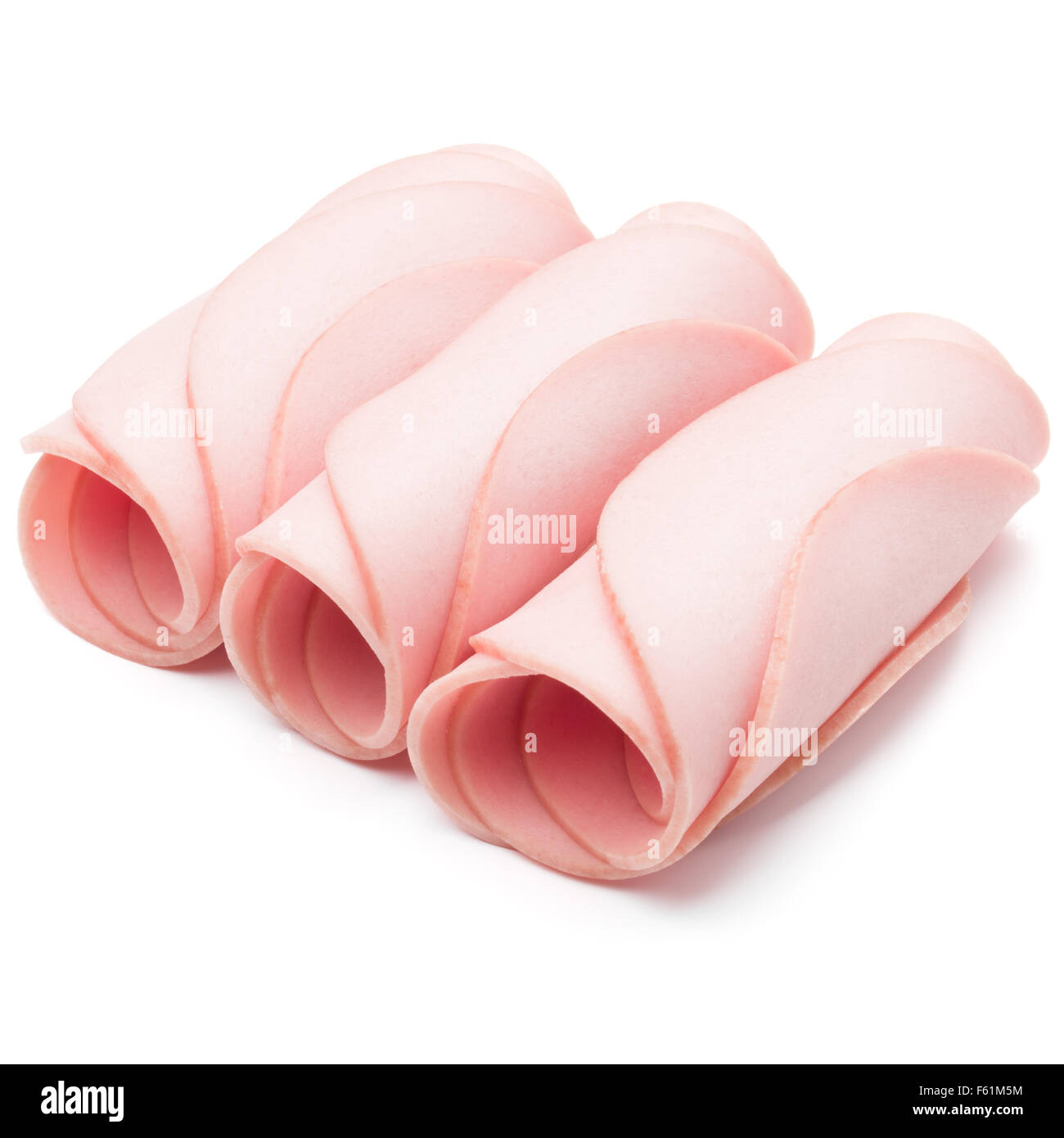 cooked boiled ham sausage or rolled bologna slices isolated on white ...