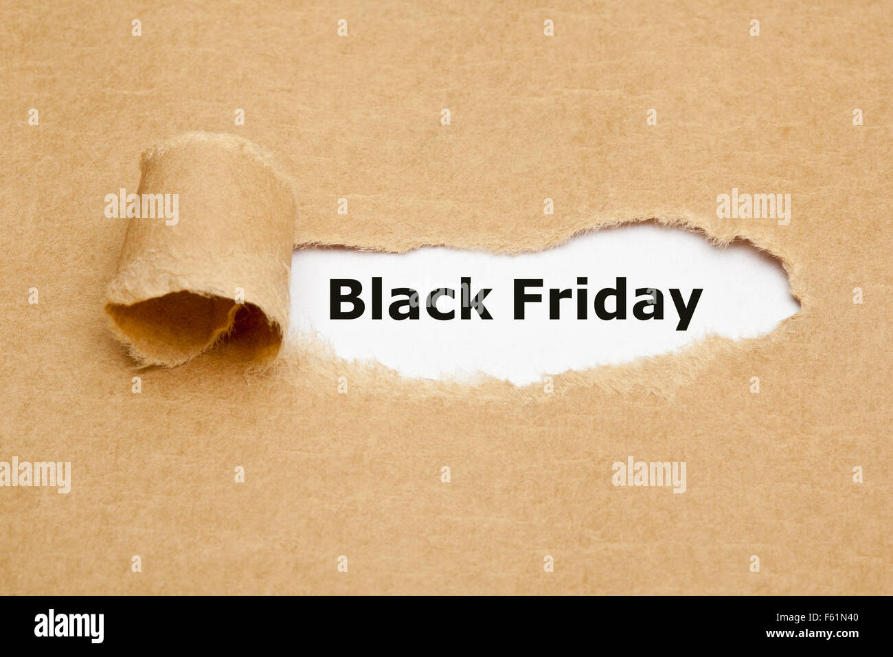 the-text-black-friday-appearing-behind-torn-brown-paper-stock-photo-alamy