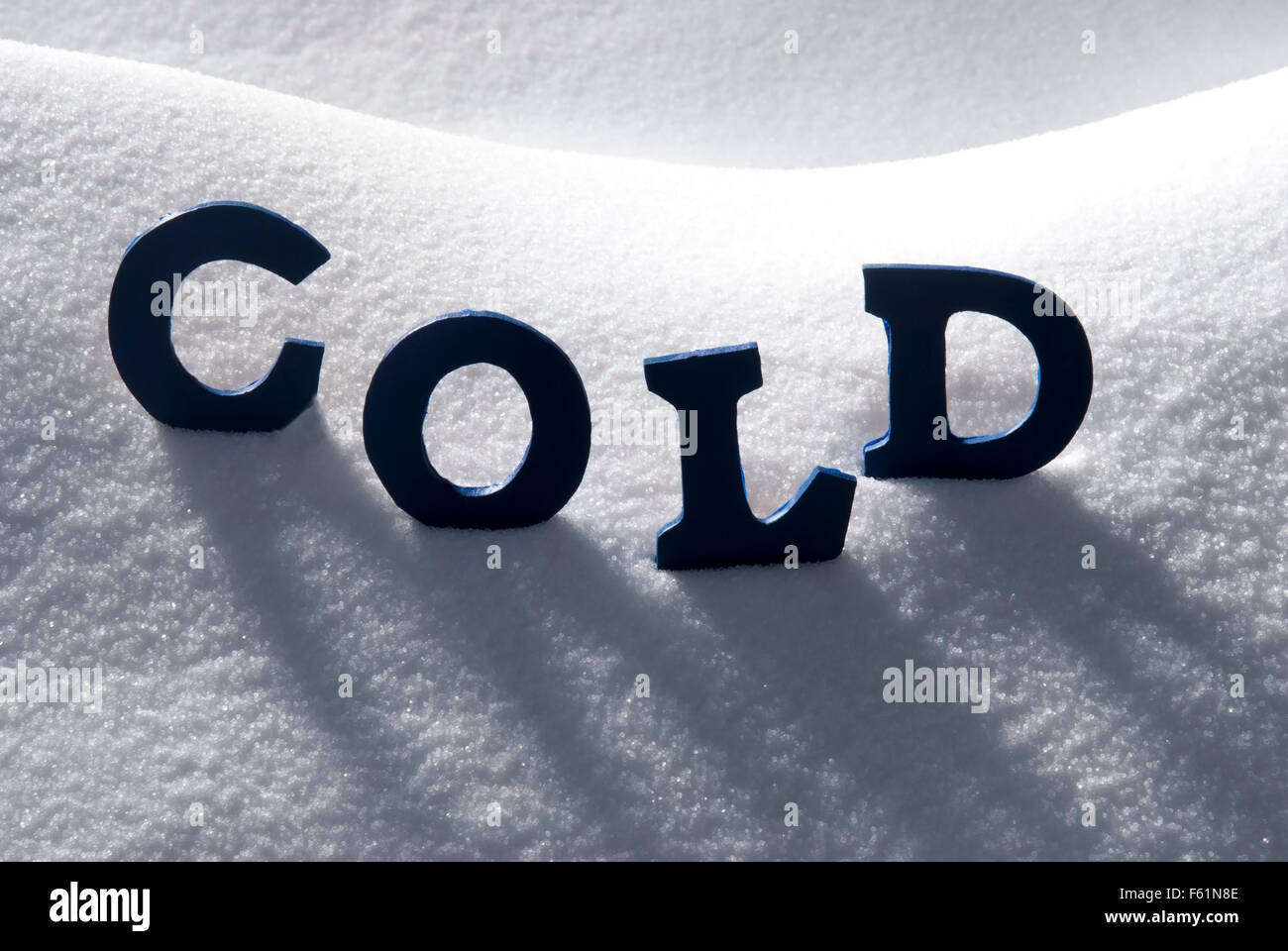 Blue Word Cold On Snow Stock Photo - Alamy